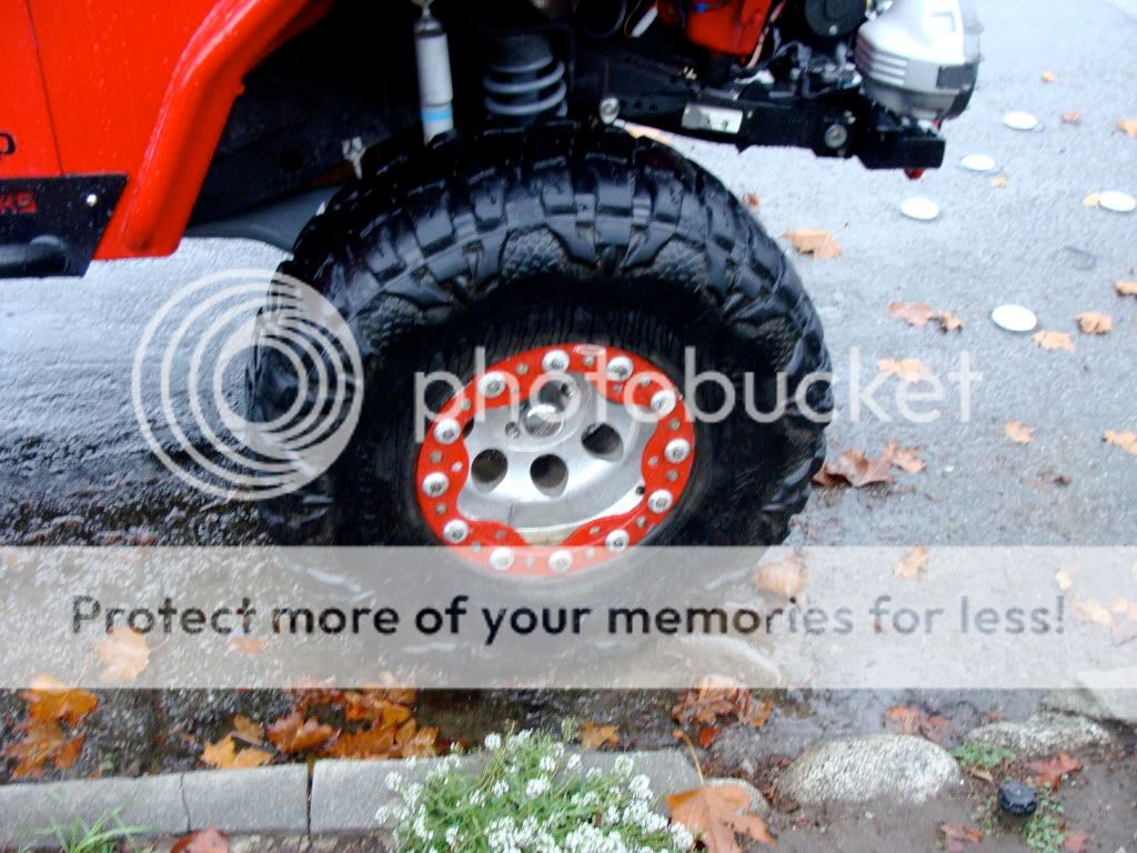 35 inch Nitto Mud Grappplers on Red OMF beadlocks. | Pirate 4x4