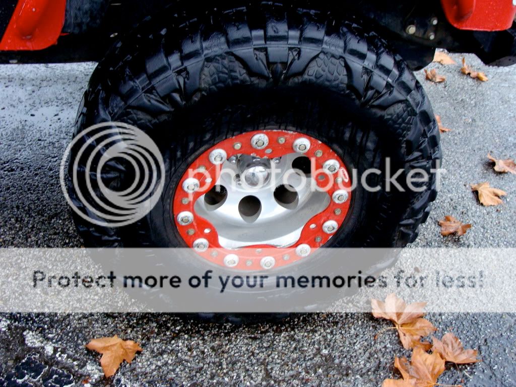 35 inch Nitto Mud Grappplers on Red OMF beadlocks. | Pirate 4x4